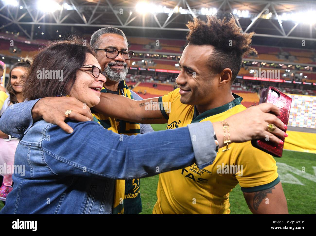 Will Genia of the Wallabies hugs his parents Elizabeth and Kilroy Genia ...