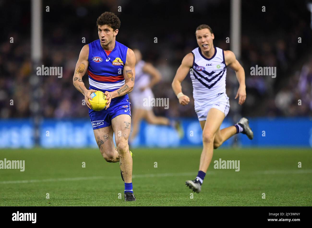 Tom Liberatore of the Bulldogs (left) and Ed Langdon of the Fremantle ...
