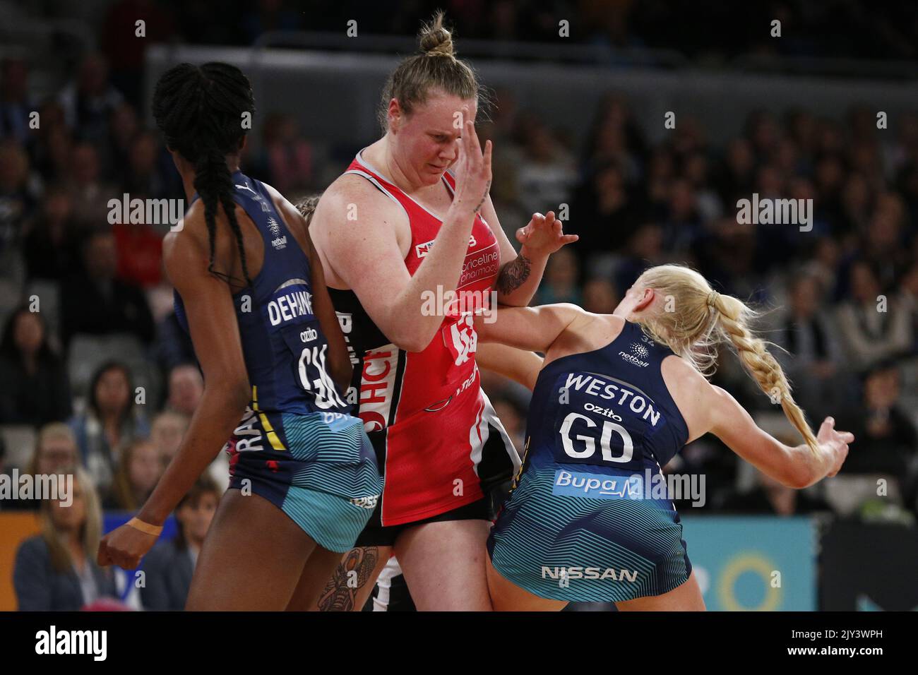 Emma Ryde of the Thunderbirds competes with Kadie-Ann Dehaney of the ...