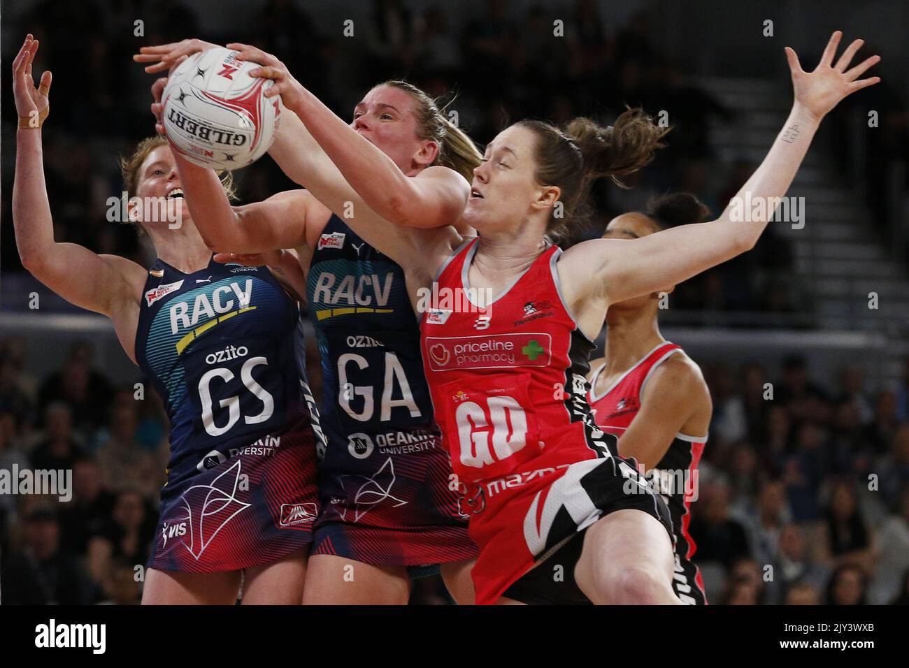 Chelsea Blackman of the Thunderbirds contests the ball with Caitlin ...