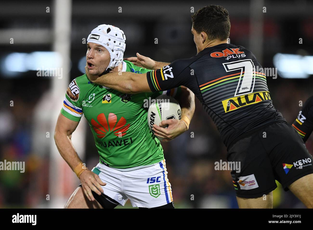 Nathan Cleary of the Panthers tackles Jarrod Croker of the Raiders ...