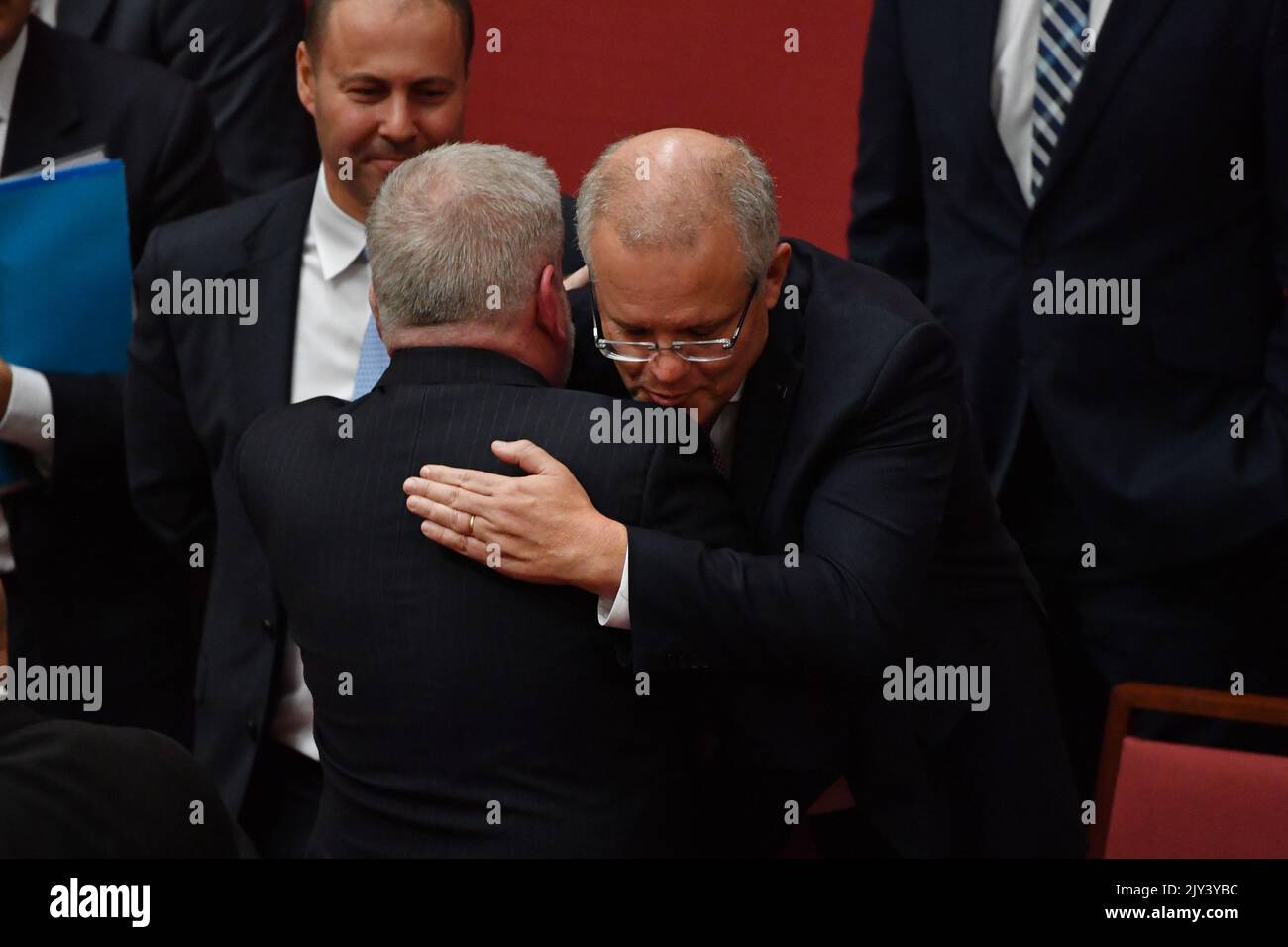 Prime Minister Scott Morrison hugs Liberal Senator Mitch Fifield after ...