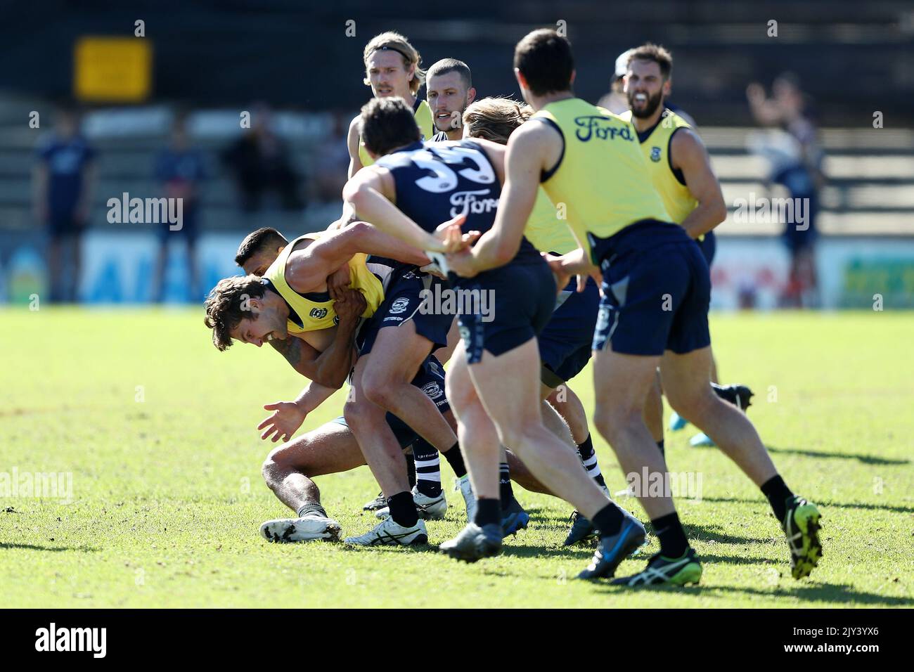 Tom Atkins is tackled by Tim Kelly during a Geelong Cats training ...