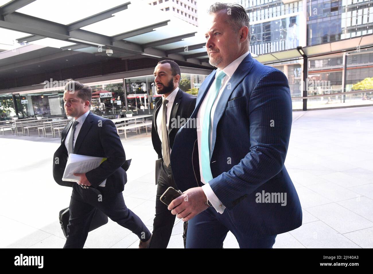 Adam Magill (right) and his lawyer Ahmed Dib (centre) arrive at the ...
