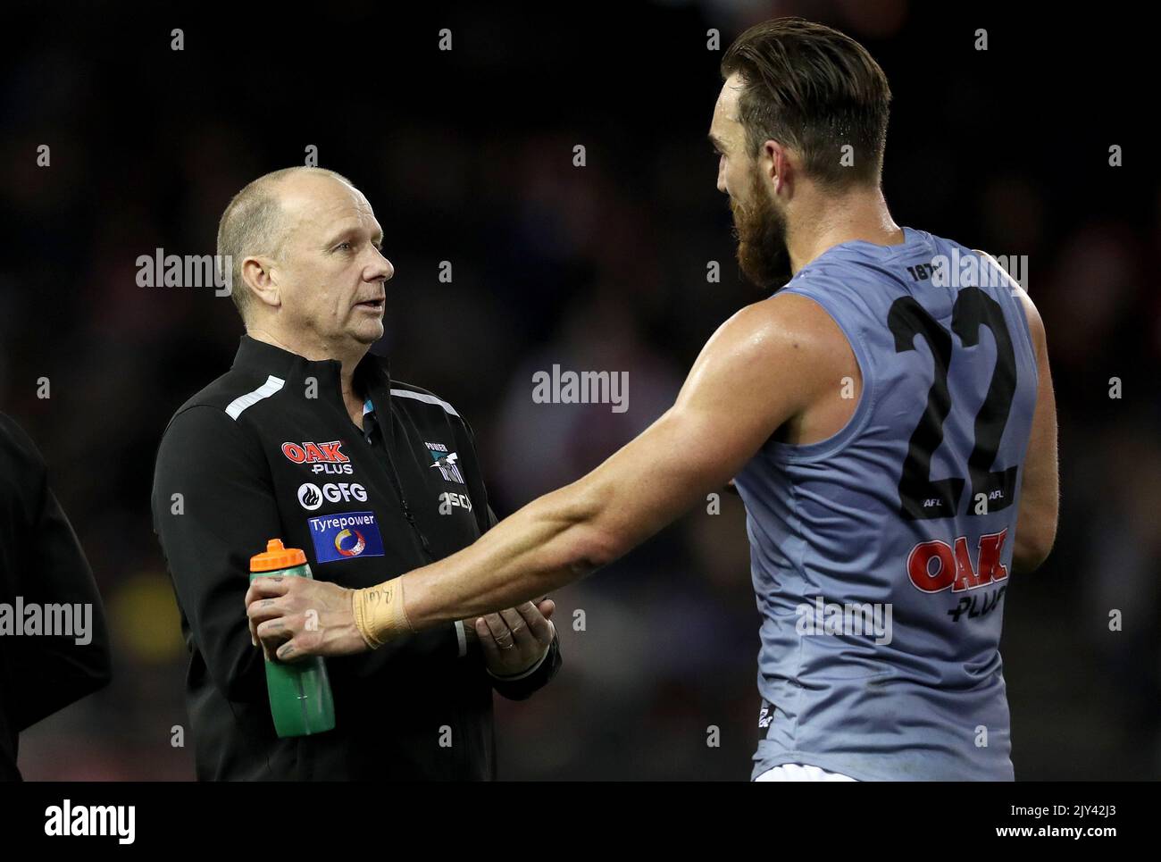 Ken Hinkley of the Power speaks with Charlie Dixon during the Round 20 ...