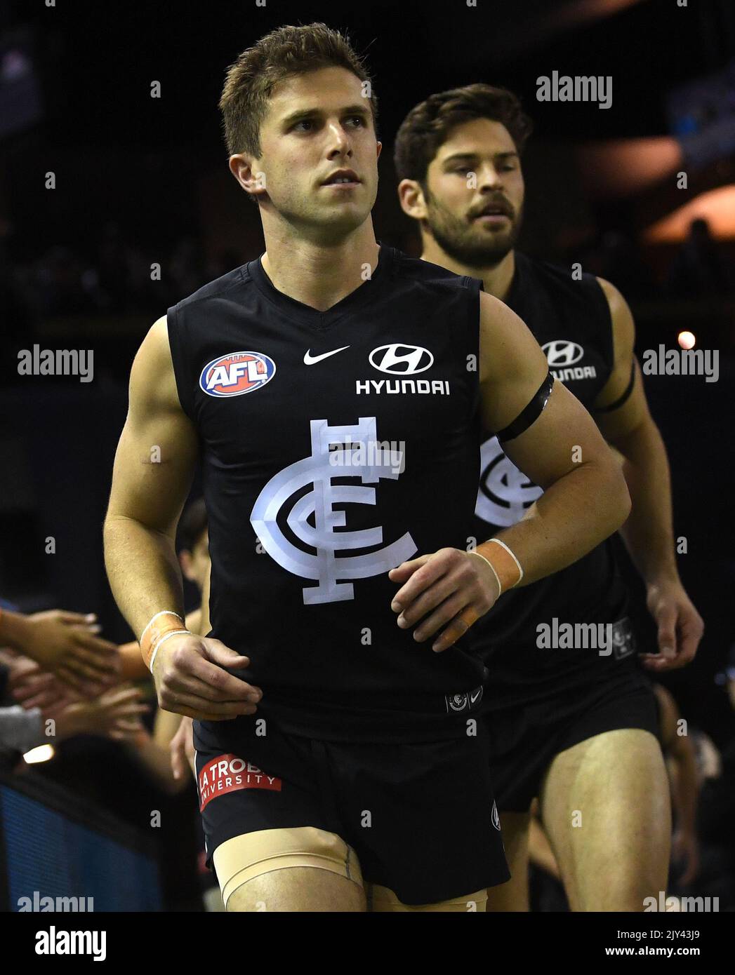 Marc Murphy of the Blues (left) is before during the Round 20 AFL match ...