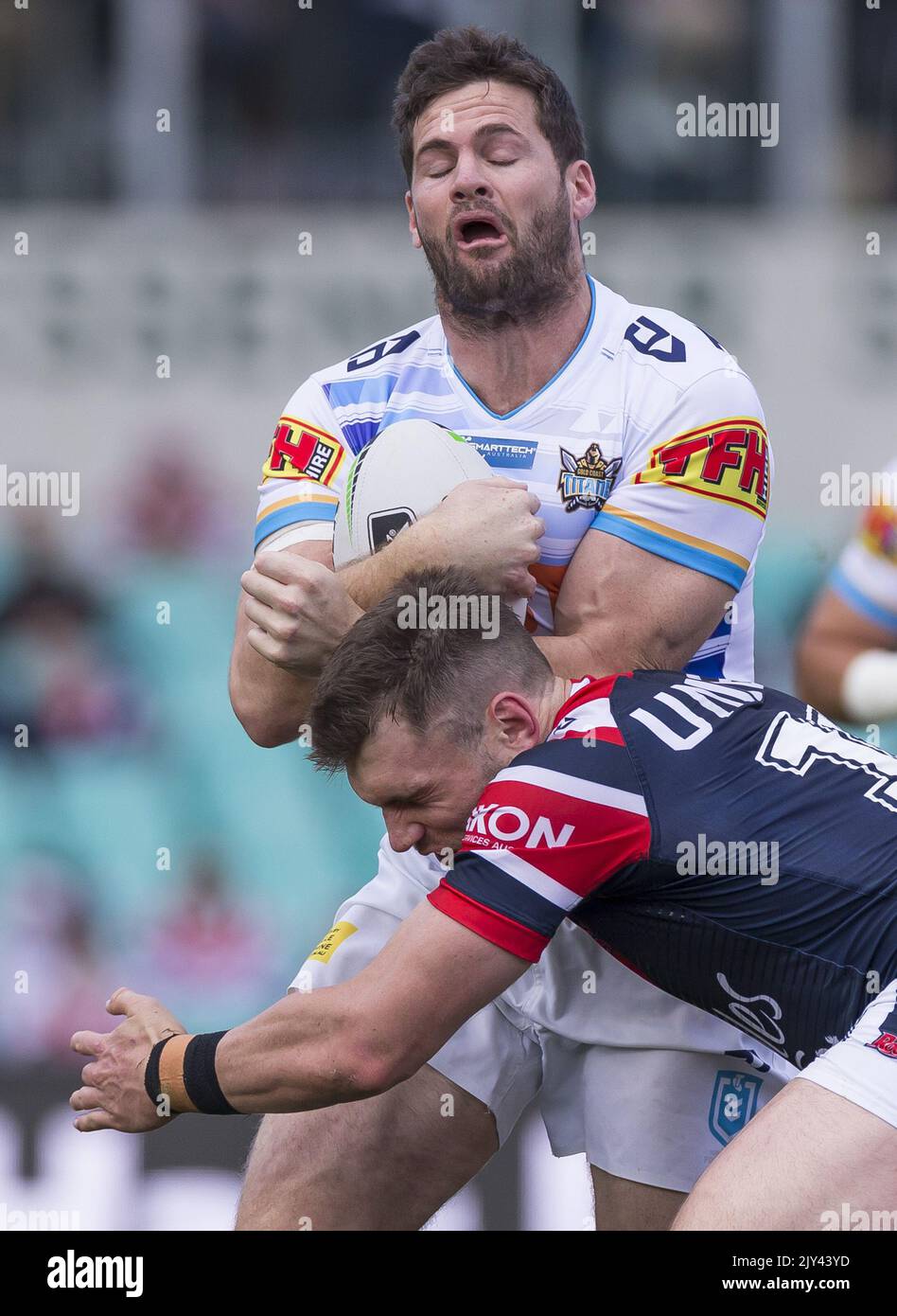 Anthony Don of the Titans is tackled during the Round 20 NRL match ...