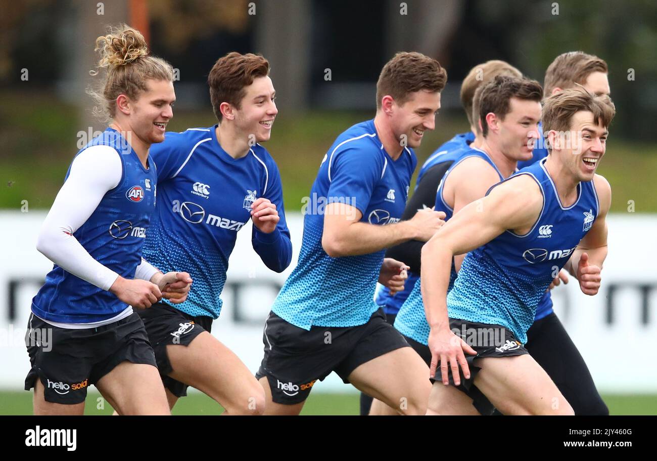 Jed Anderson (L) and Trent Dumont (R) of the Kangaroos run during a ...