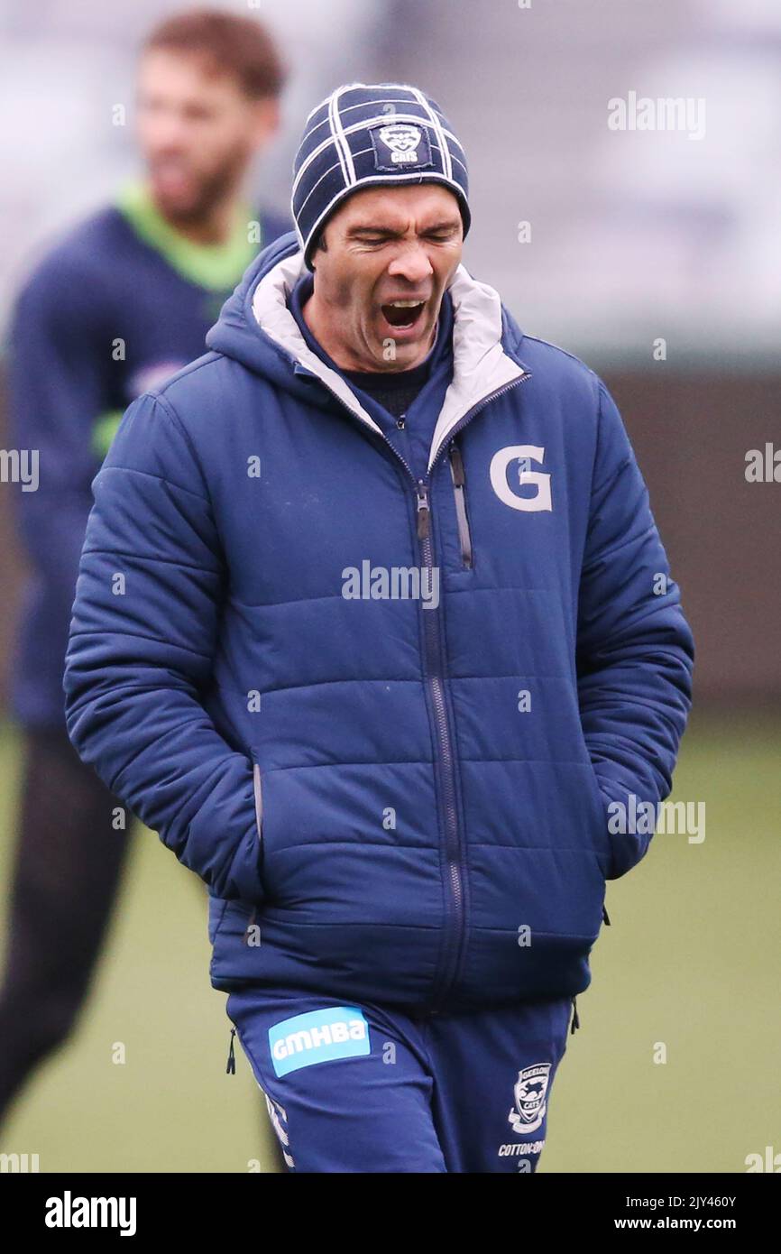 Cats head coach Chris Scott breaks into a yawn during a Geelong Cats ...