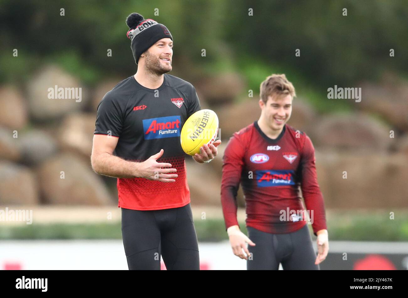 Tom Bellchambers of the Bombers and Zach Merrett of the Bombers look on ...