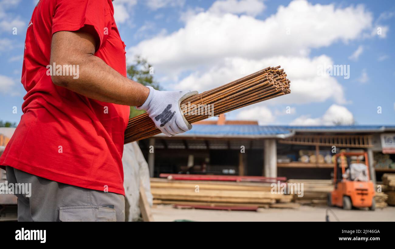 Construction holding rebar construction site hi-res stock photography ...