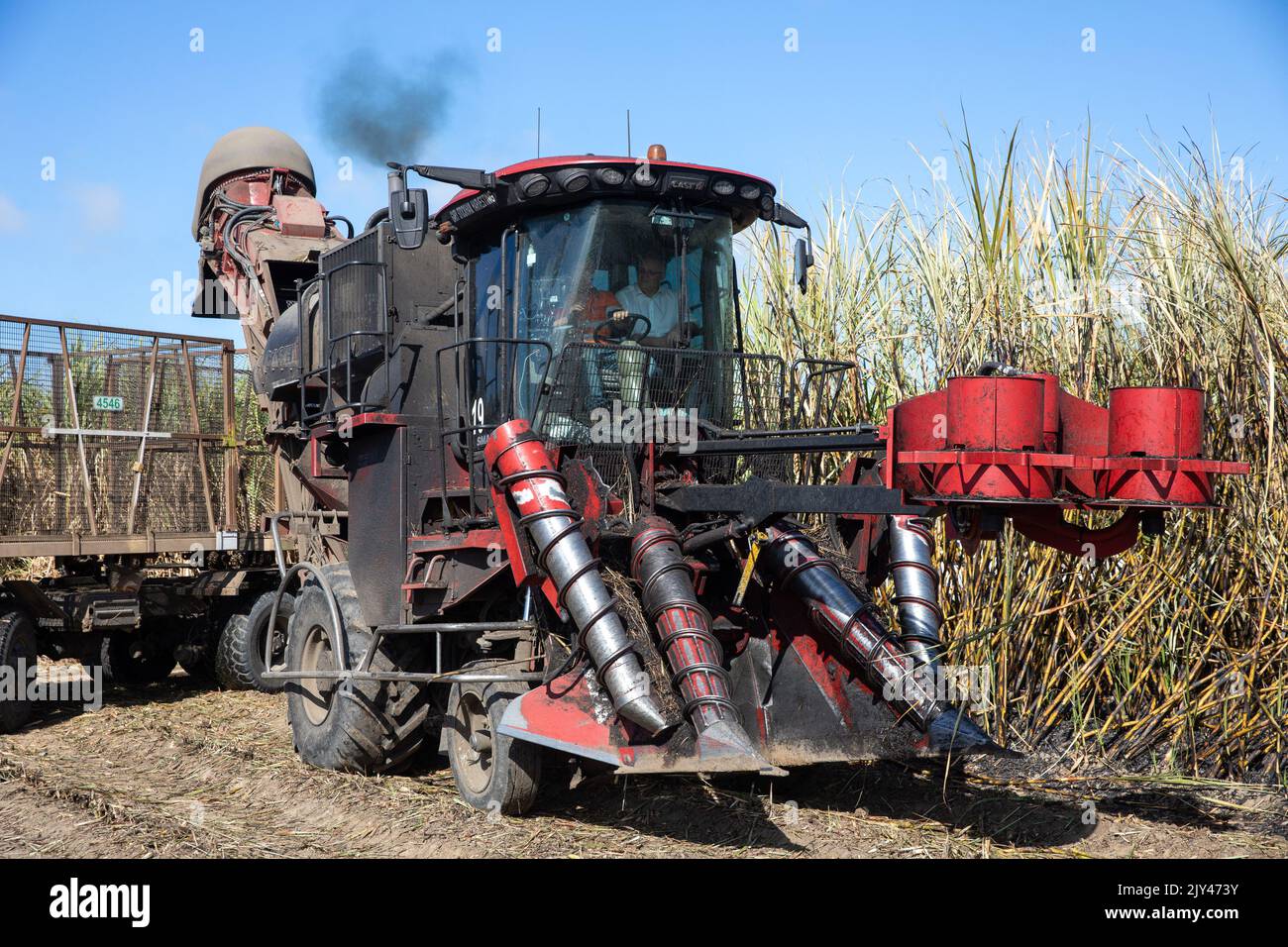Prime Minister Scott Morrison in a cane harvester with operator Anthony Corica during a visit to ...