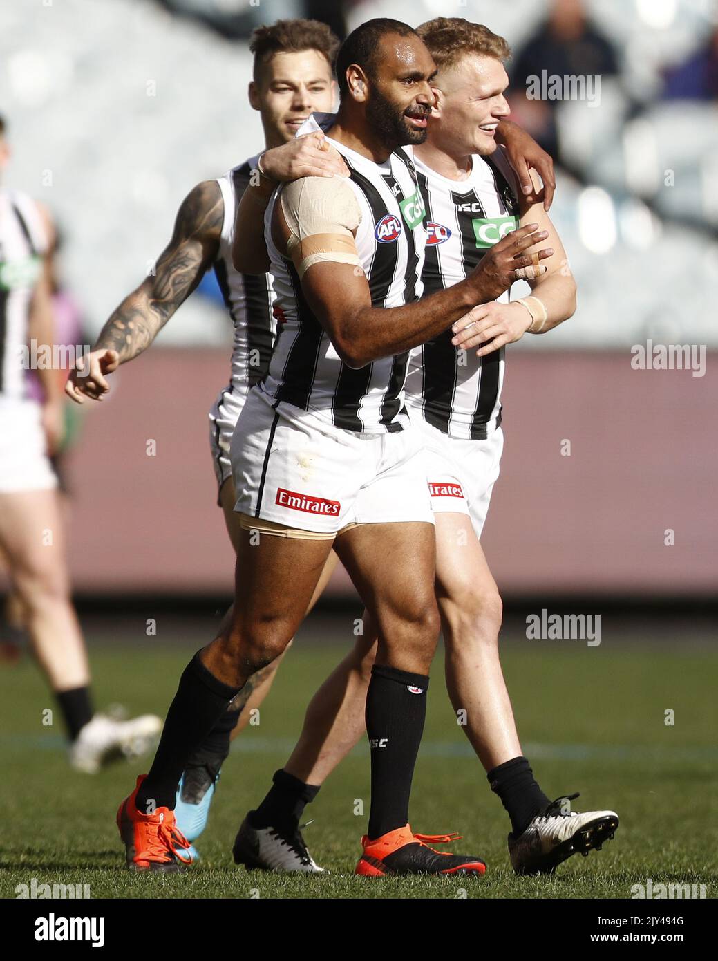 Travis Varcoe of the Magpies (centre) celebrates a goal during the ...