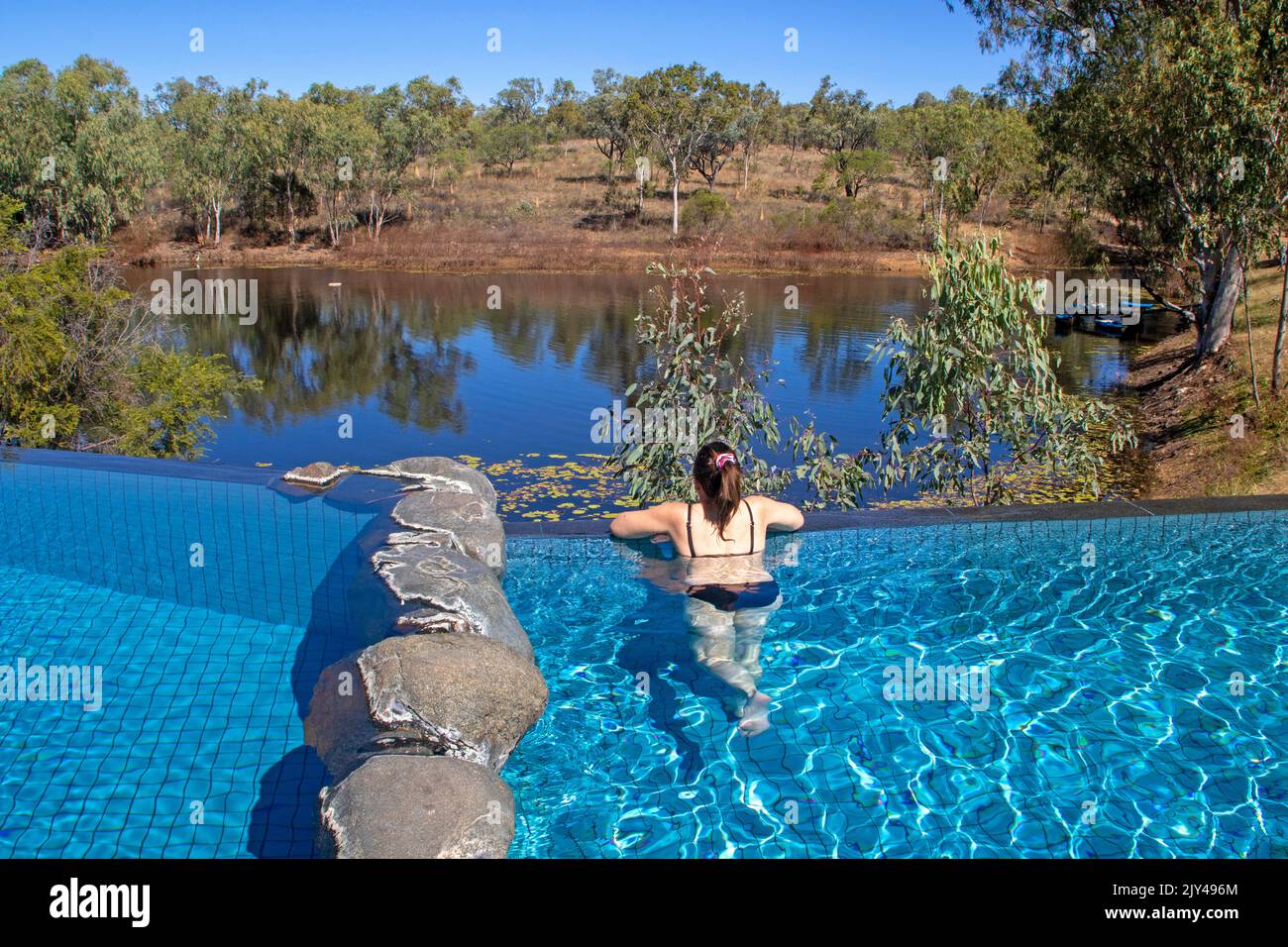 Woman on swimming pool hi-res stock photography and images - Alamy