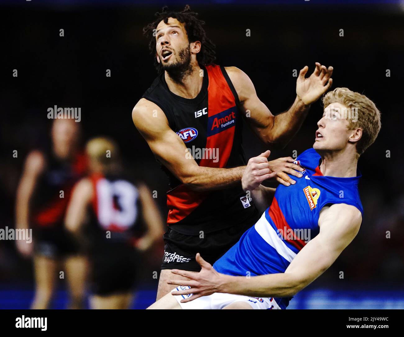 Zac Clarke of the Bombers pushes away Tim English of the Bulldogs ...