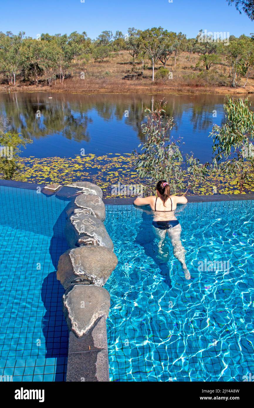 Woman in the infinity pool at Cobbold Gorge Stock Photo - Alamy