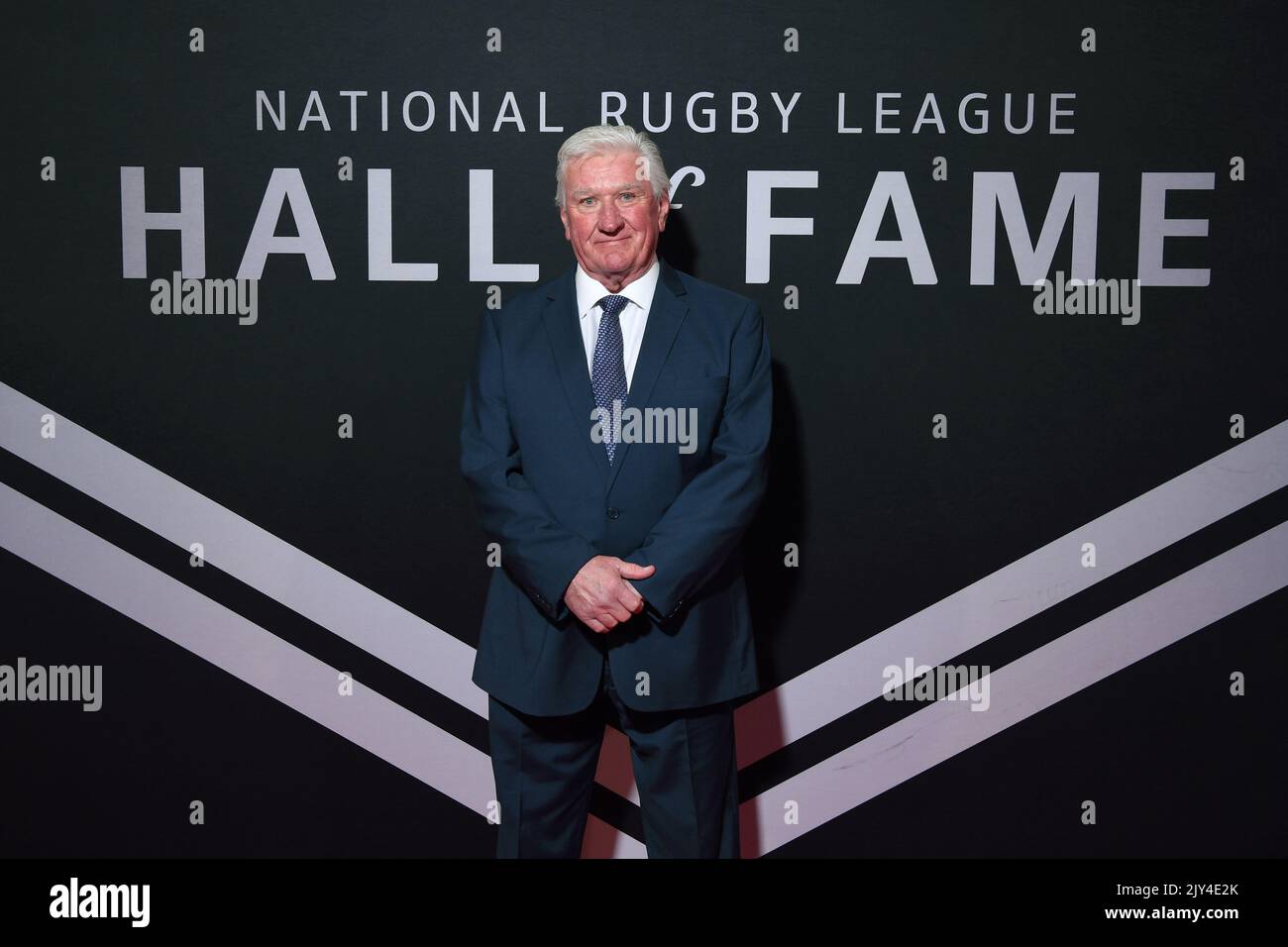 Ray Warren poses for a photo on the red carpet at the 2019 NRL Hall of ...