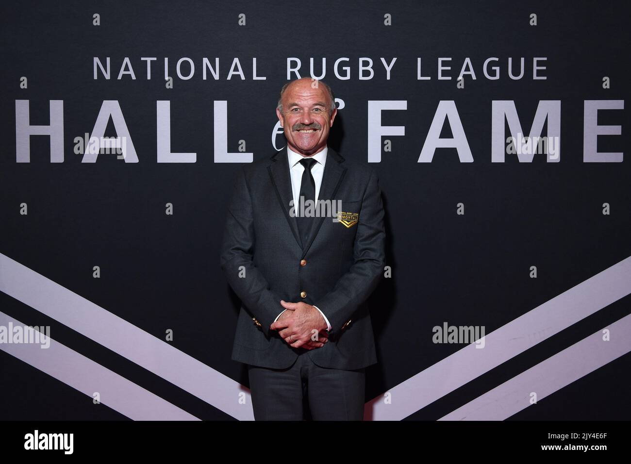 Wally Lewis poses for a photo on the red carpet at the 2019 NRL Hall of ...