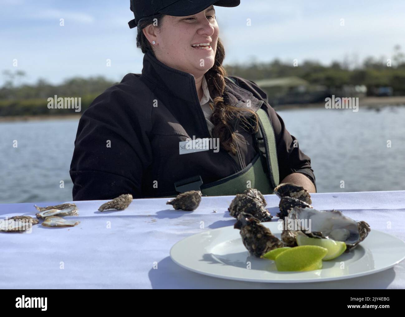 Guide Chella Armstrong from Saffire Freycinet serves fresh oysters at ...