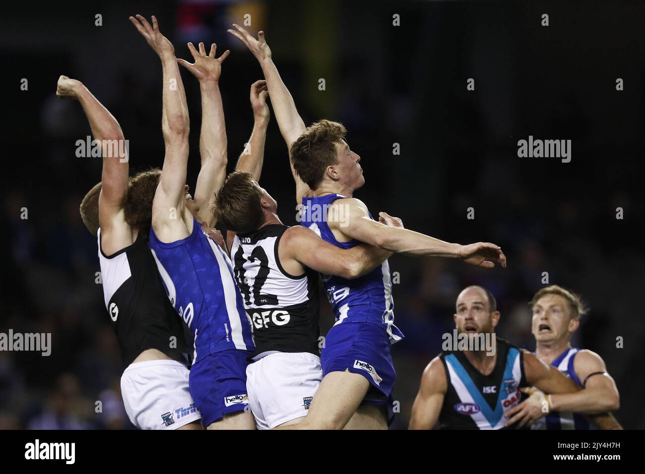 A pack of players fly for the ball during the Round 22 AFL match ...