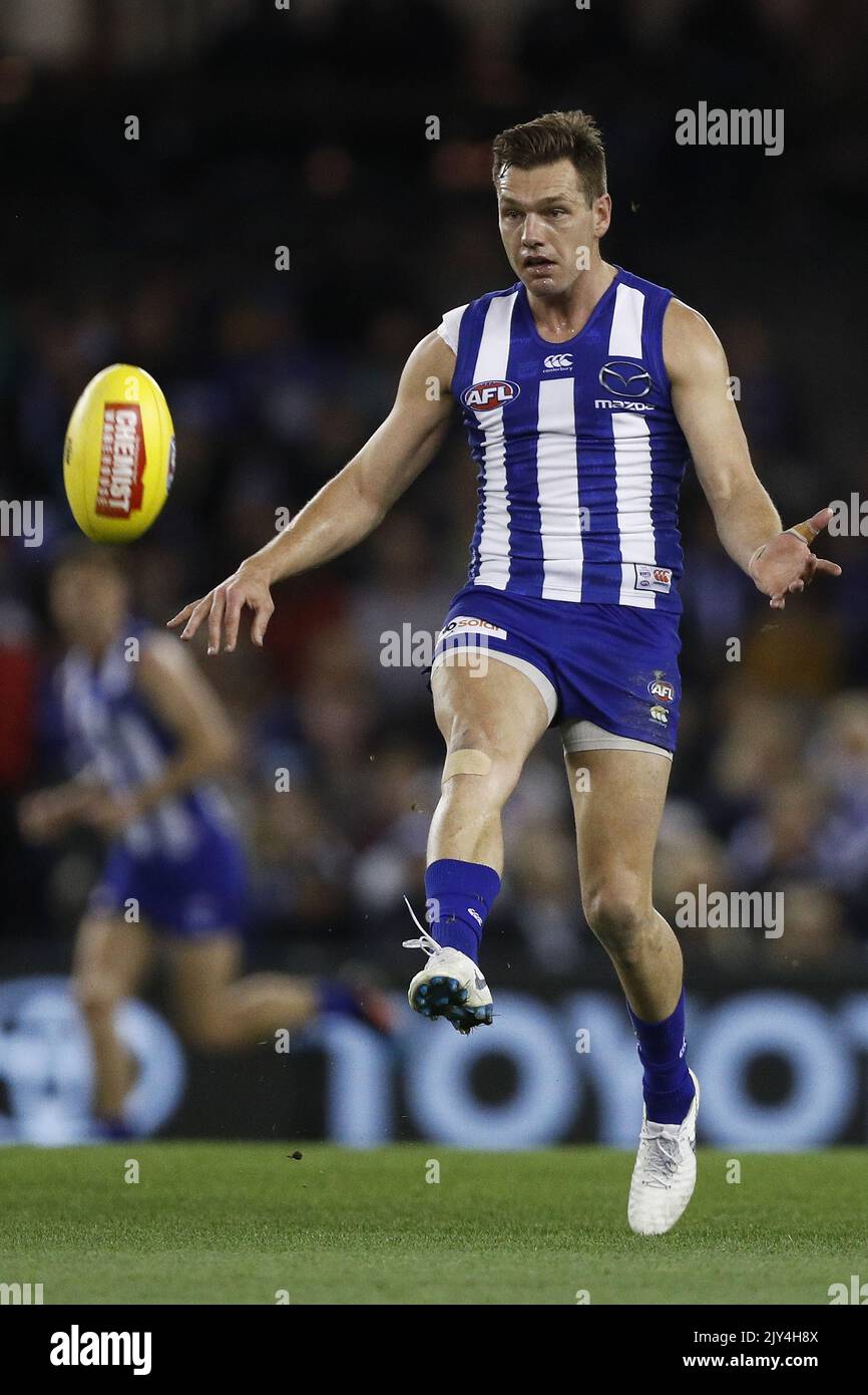 Shaun Higgins of the Kangaroos kicks the ball during the Round 22 AFL ...
