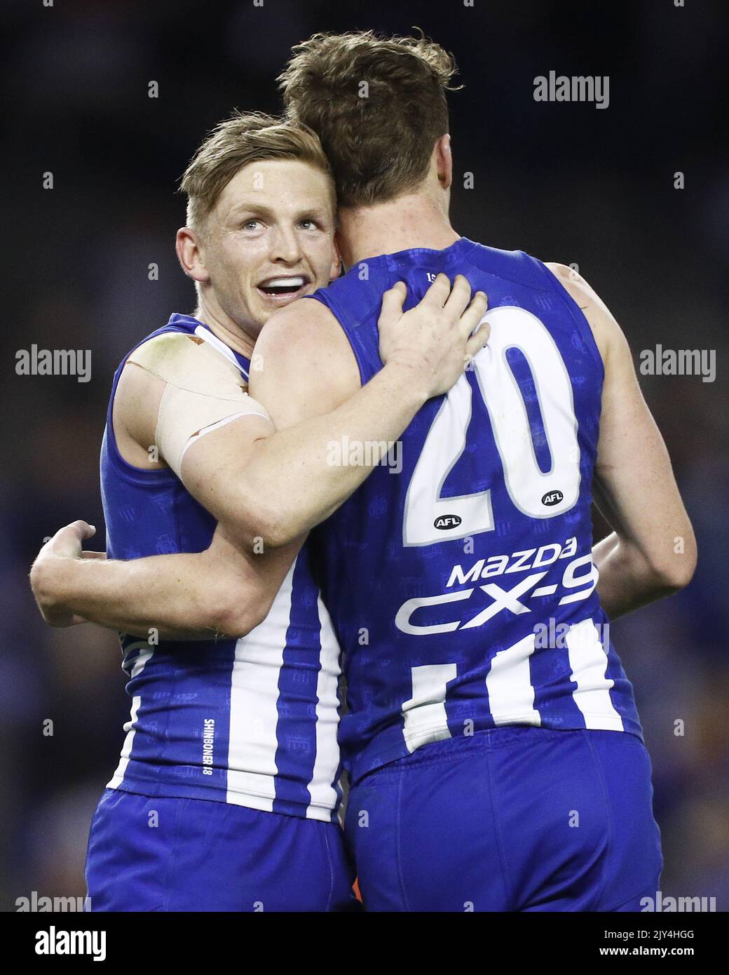 Jack Ziebell of the Kangaroos (left) celebrates a Nick Larkey (right ...