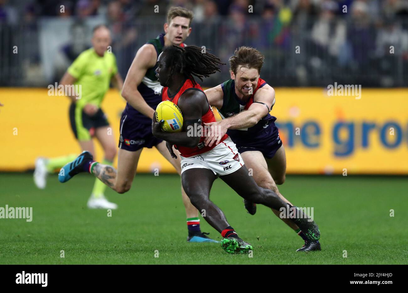 Adam Saad of the Bombers is tackled by Joel Hamling of the Dockers ...
