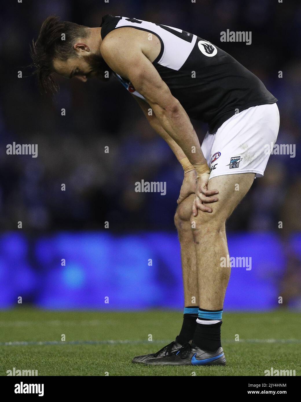 Charlie Dixon of the Power looks dejected after the Round 22 AFL match ...