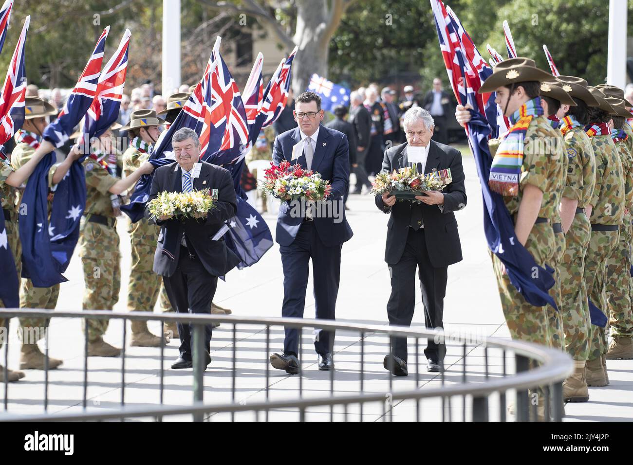Victorian Premier Daniel Andrews (centre) lays a wreath at the Shrine ...