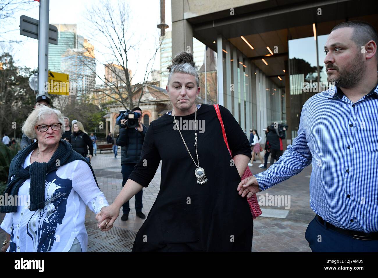 Lisa Giles (centre) leaves the NSW Supreme Court in Sydney, Tuesday ...