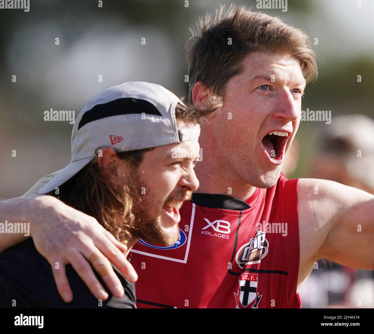 Sam Rowe, picked to play his 100th match, reacts with Jack Steven (left ...