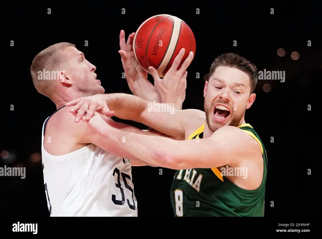 Mason Plumlee of the USA fouls Matthew Dellavedova of Australia as he ...