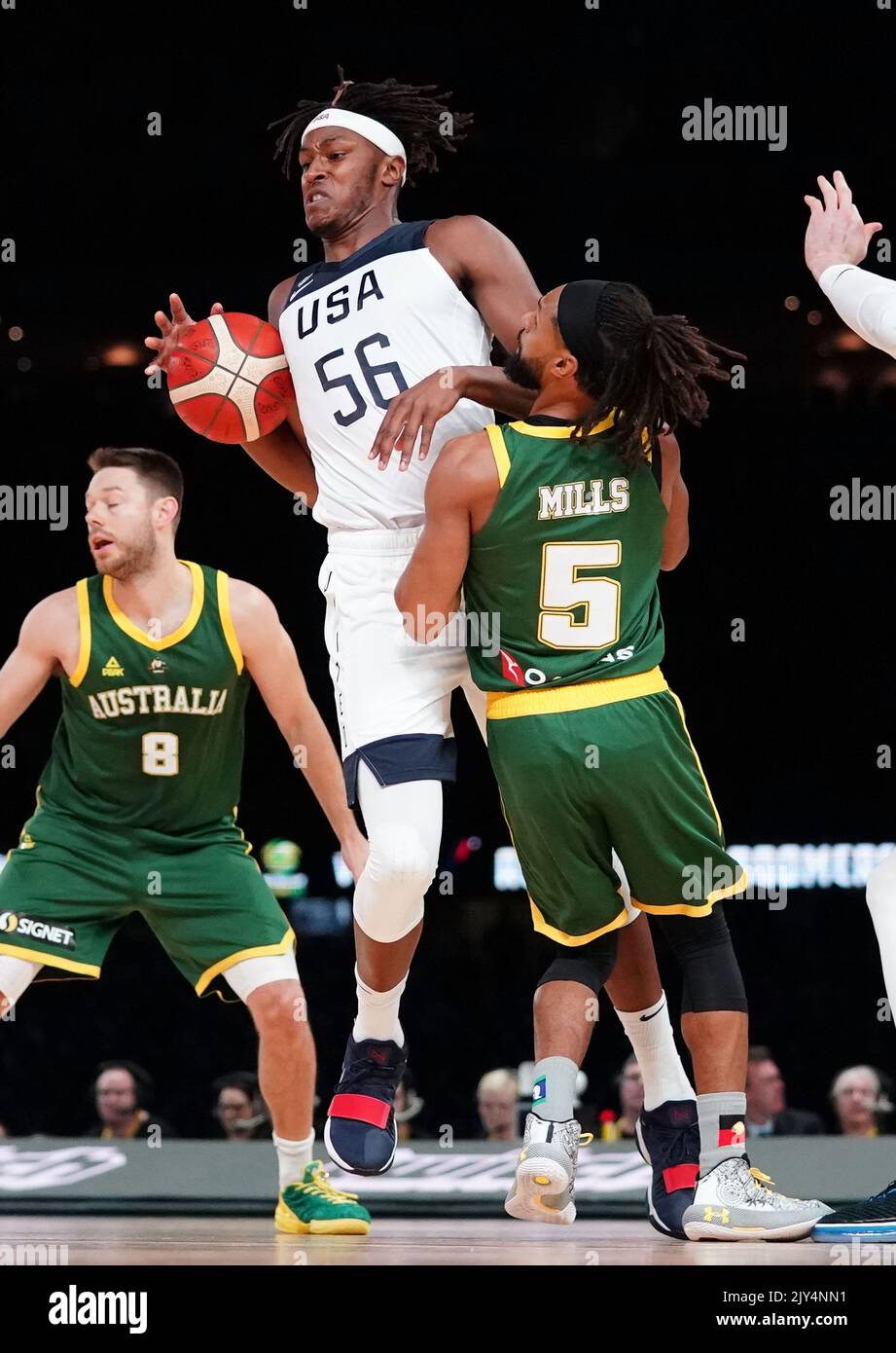 Myles Turner of the USA and Patty Mills of Australia compete for the ...