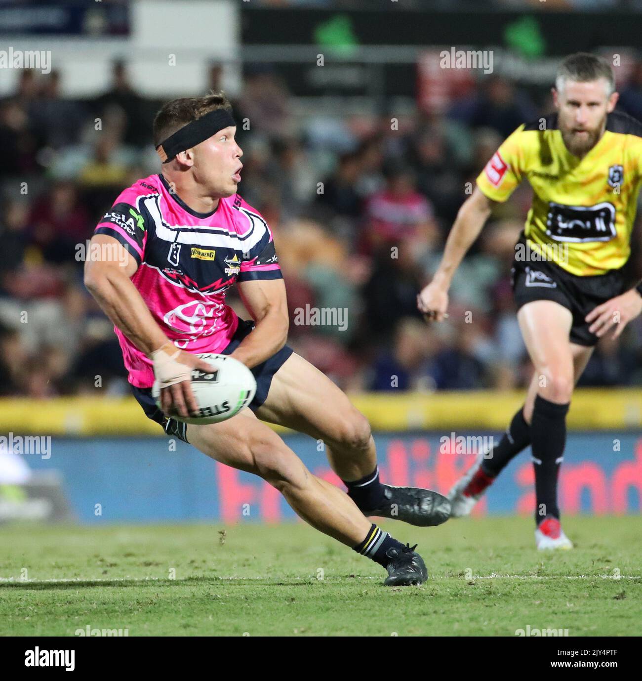 Reuben Cotter of the Cowboys gets a pass away during the Round 23 NRL ...
