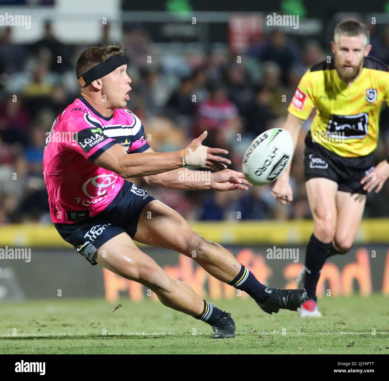 Reuben Cotter of the Cowboys gets a pass away during the Round 23 NRL ...