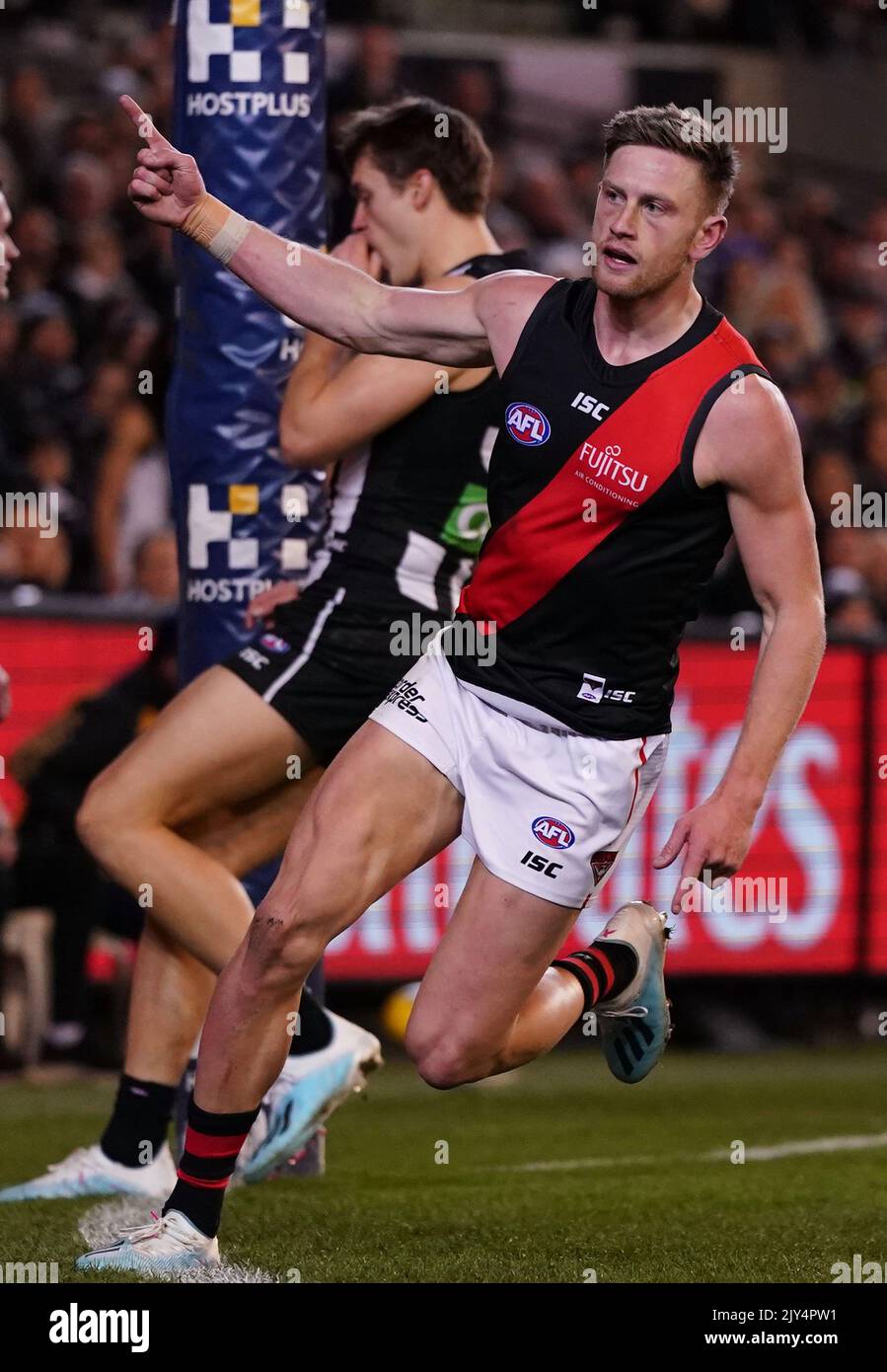 Jayden Laverde of the Bombers celebrates after kicking a goal during ...