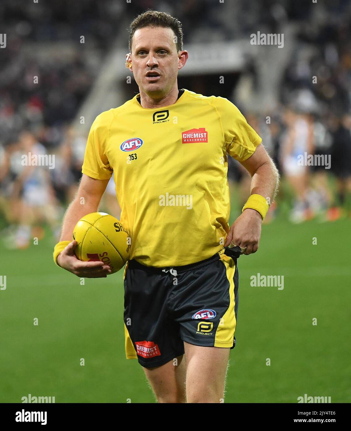 AFL Umpire Shane McInerney leaves the field after the Round 23 AFL ...