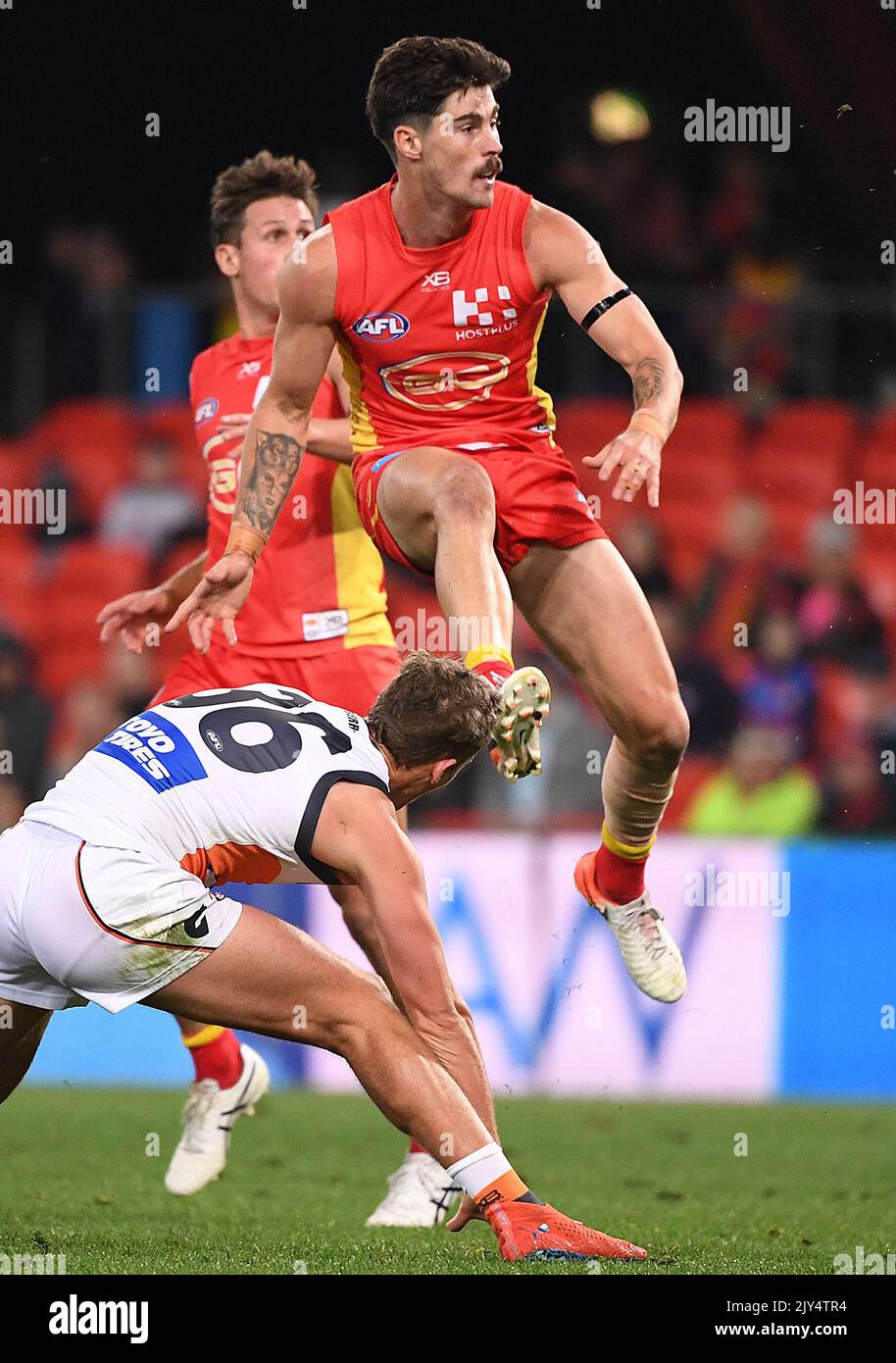 Alex Sexton of the Suns looks on after kicking for goal during the ...