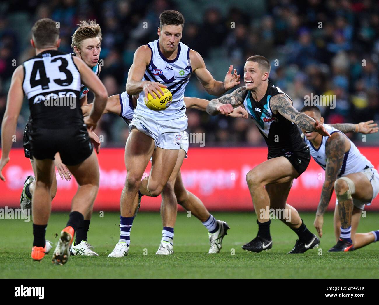 Ethan Hughes of the Dockers kicks the ball during the Round 23 AFL ...