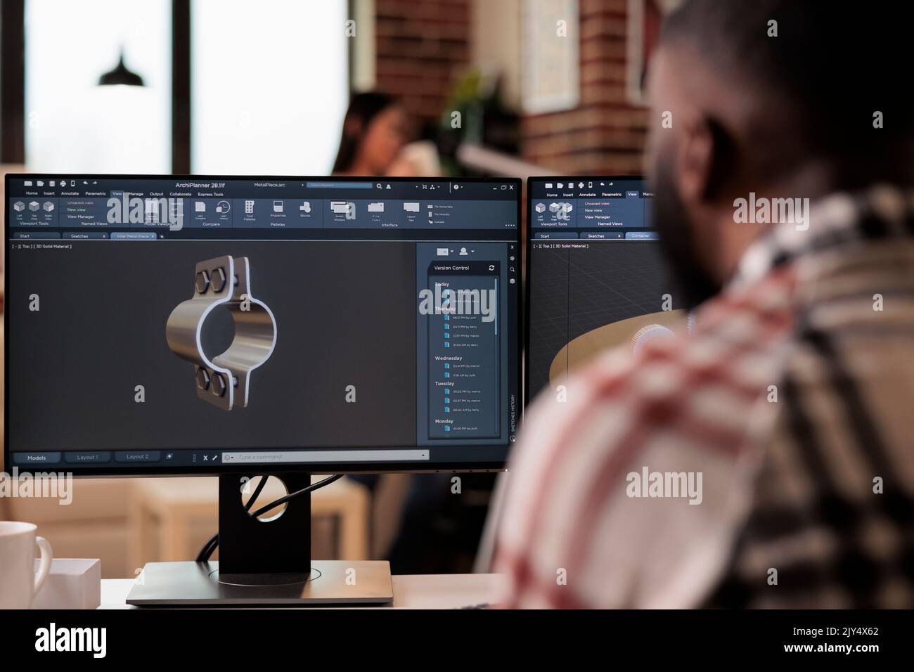 Cad engineer working with manufacturing software to develop industrial ...