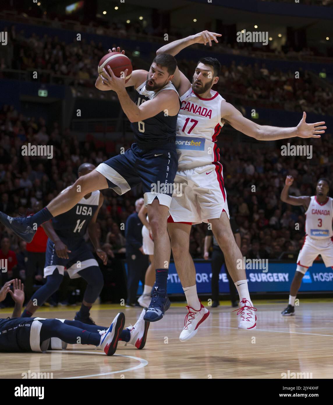 Owen Klassen of Canada and Joe Harris of the USA contest a ball during ...