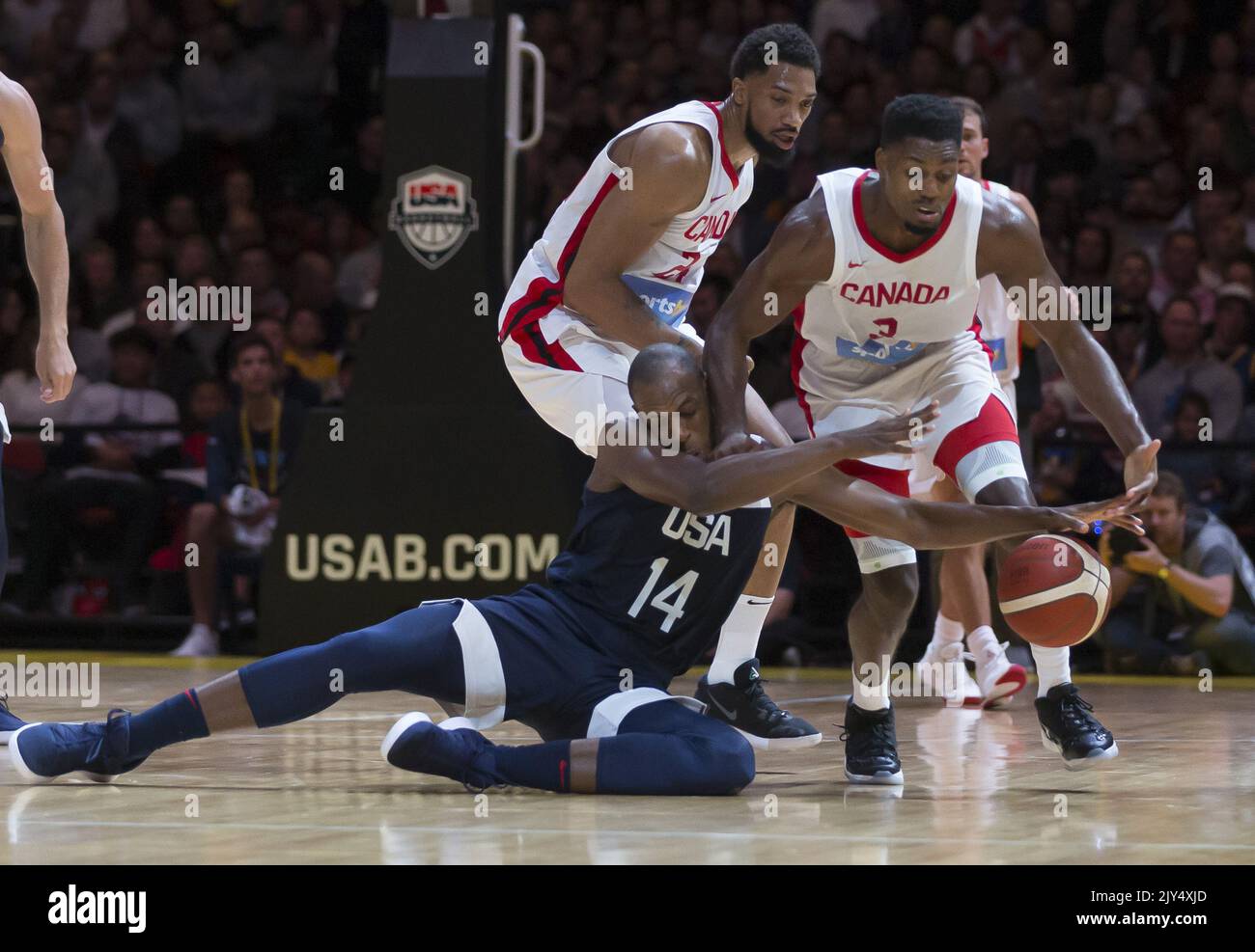 Khris Middleton of the USA and Melvin Ejim of Canada collide during the ...