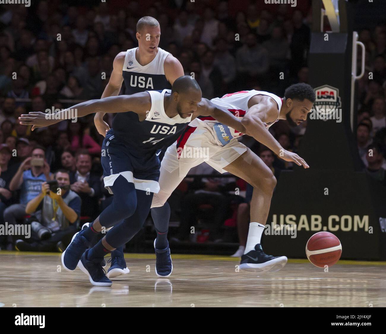 Khris Middleton of the USA and Melvin Ejim of Canada collide during the ...