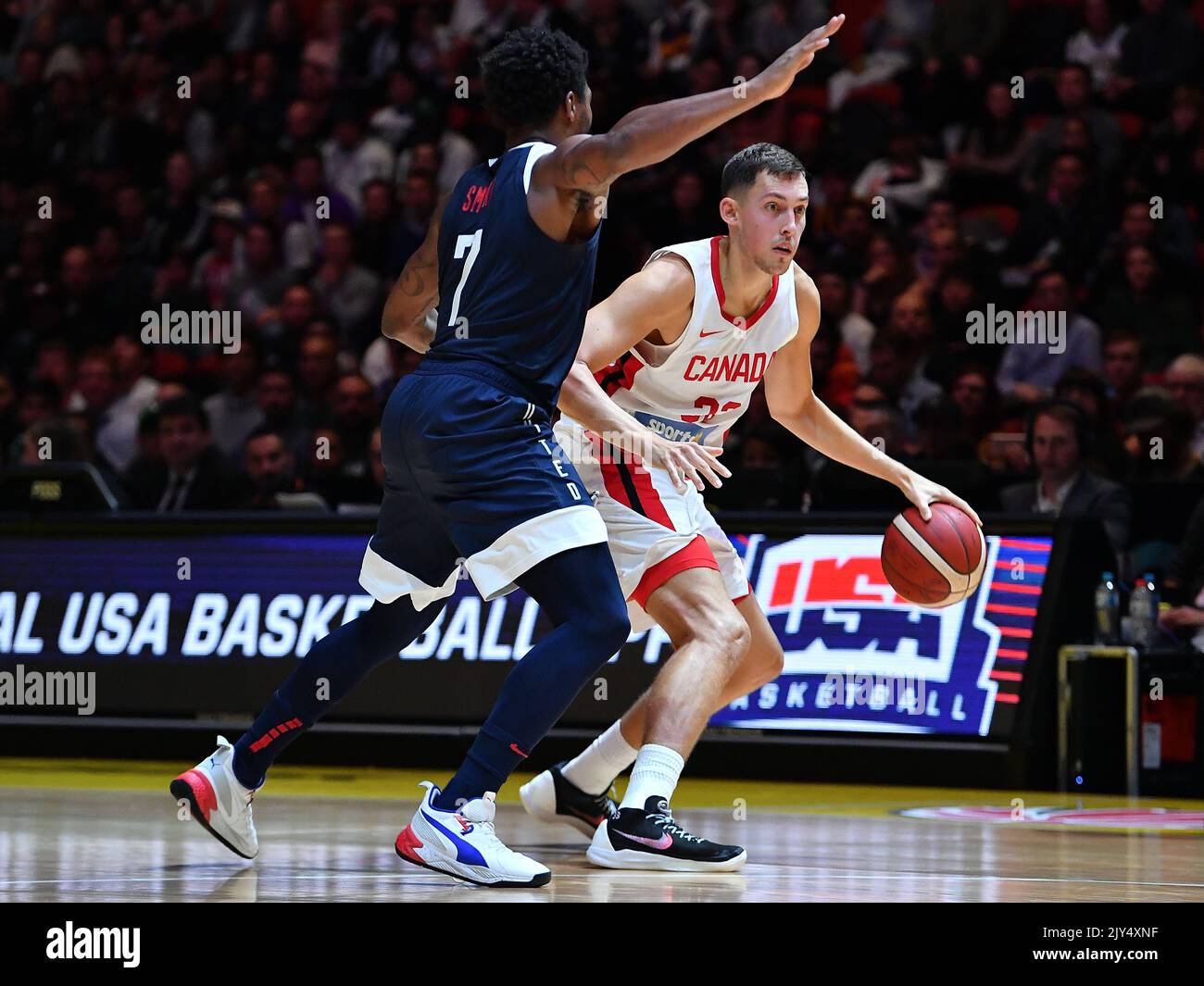 Kyle Wiltjer of Canada under pressure from Marcus Smart of the USA ...