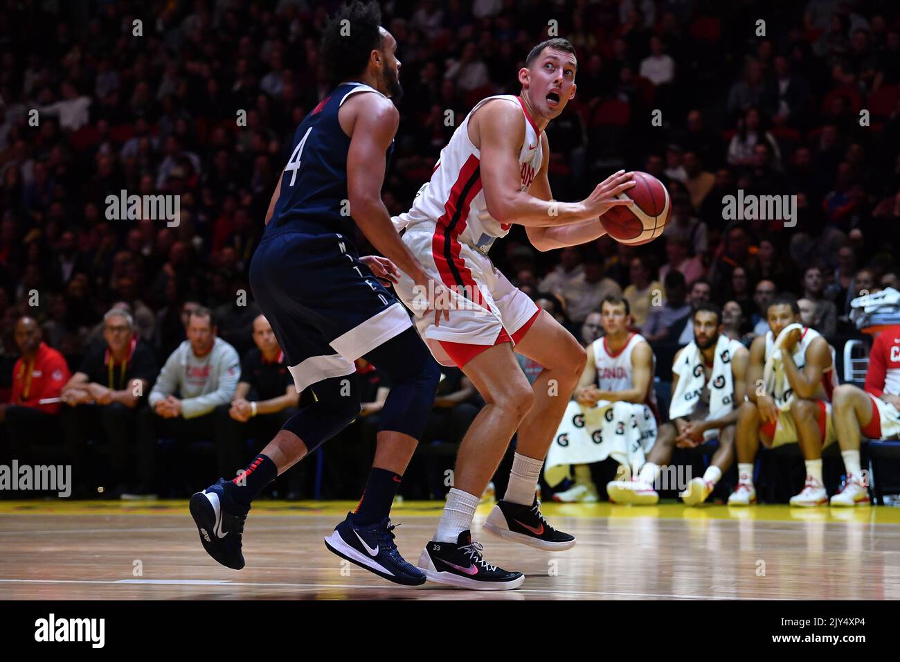 Kyle Wiltjer of Canada under pressure from Derrick White of the USA ...