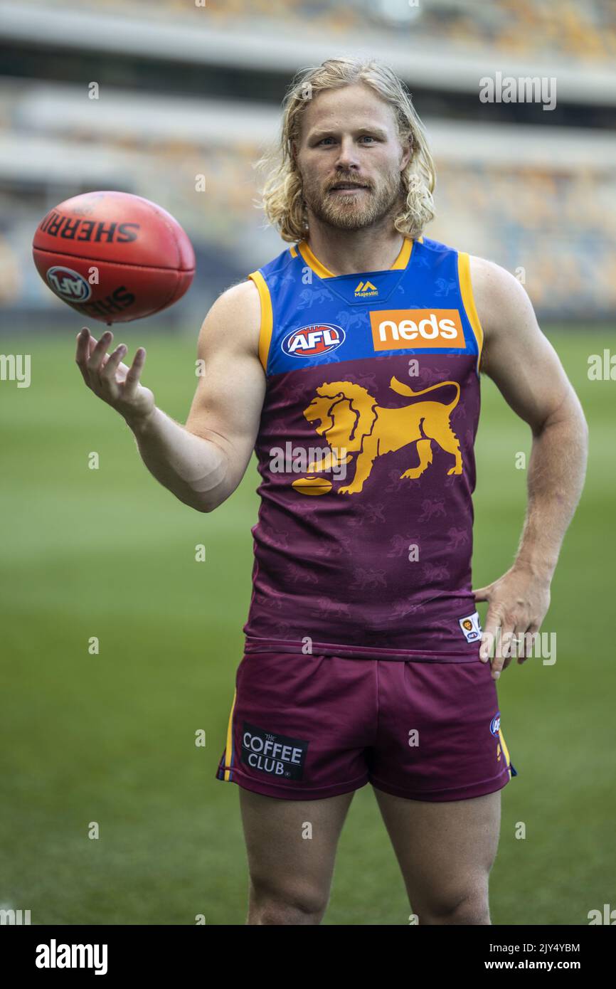 Brisbane Lions player Daniel Rich poses for a photograph during a media ...