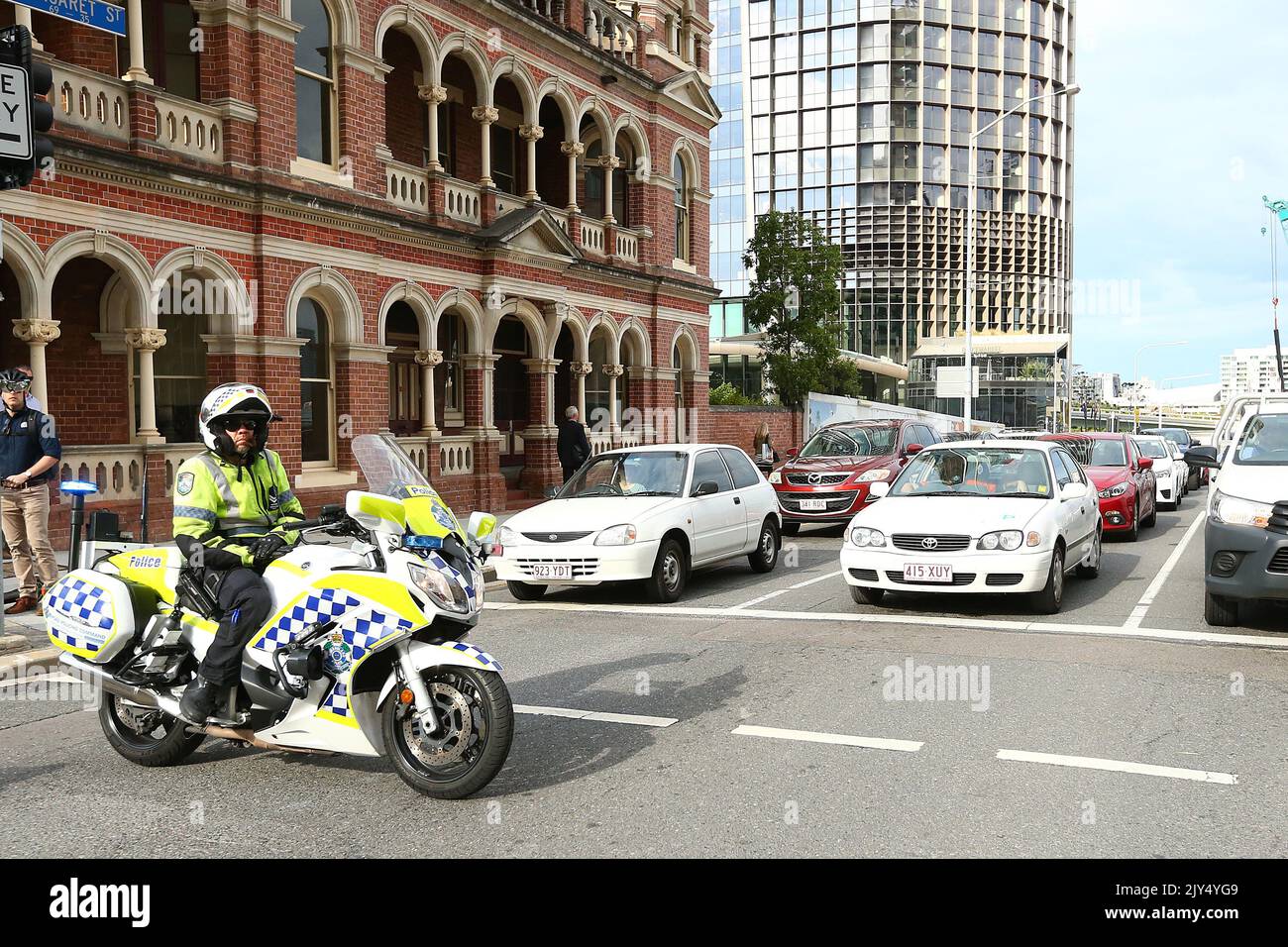 Qld Police vehicles barricade traffic as a protest makes its way ...