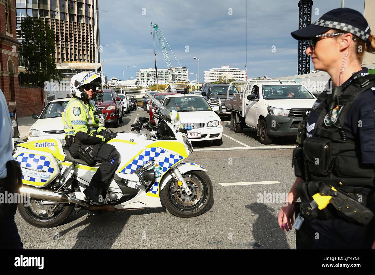 Qld Police vehicles barricade traffic as a protest makes its way ...