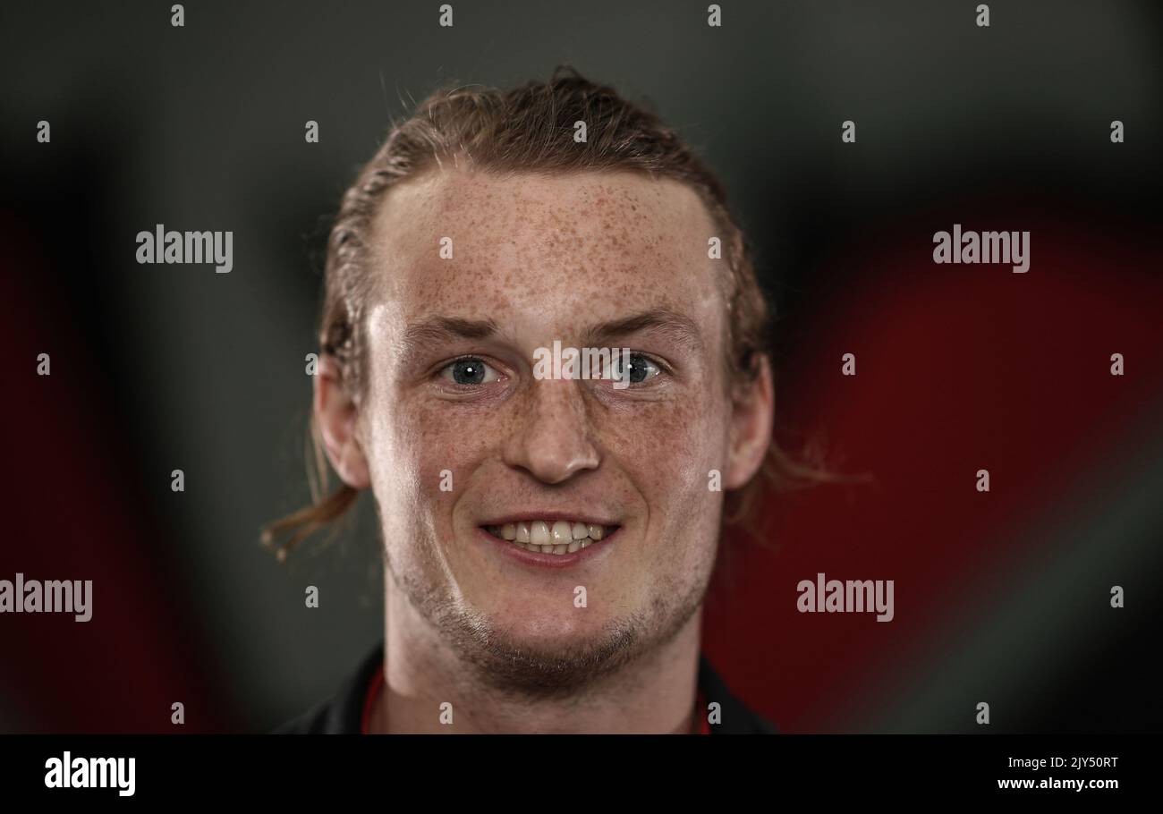 Mason Redman poses for a photograph during an Essendon Bombers media ...
