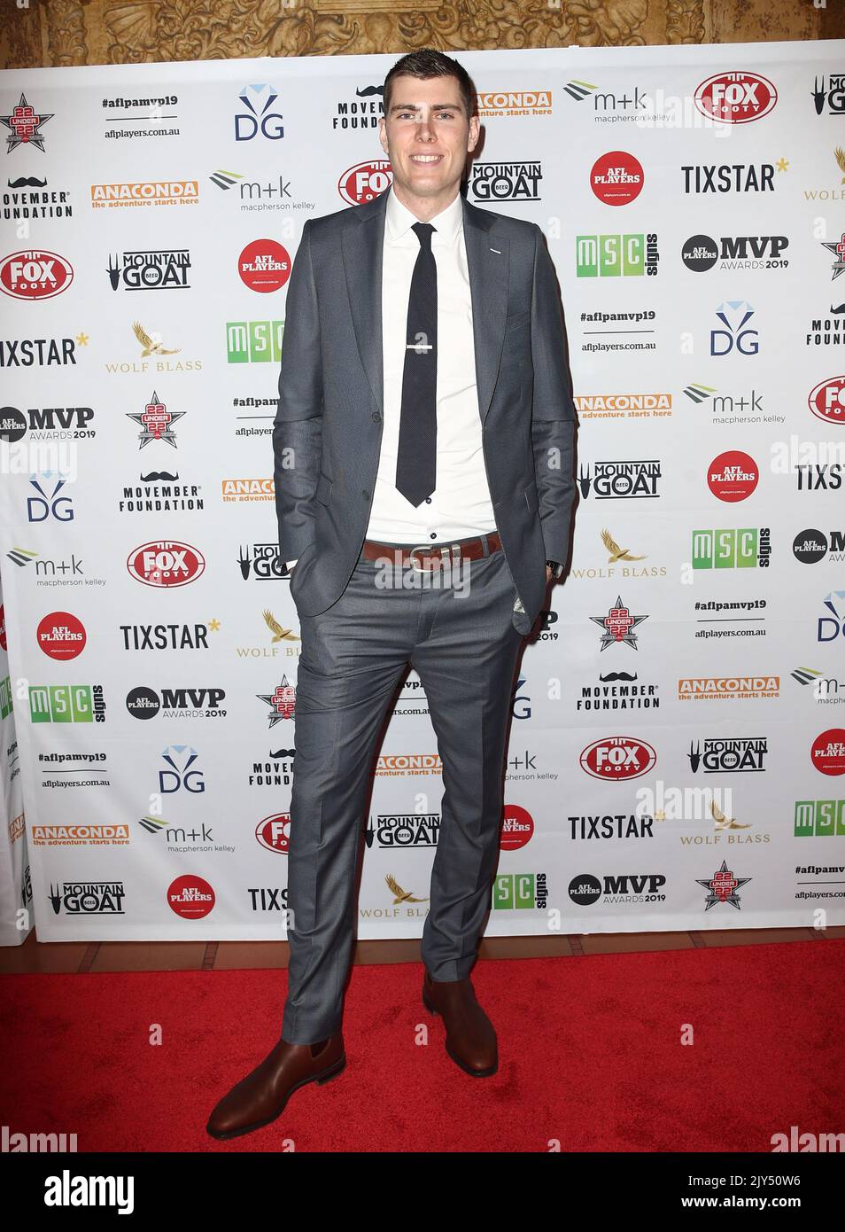 Mason Cox of the Magpies poses for a photograph on the red carpet at ...